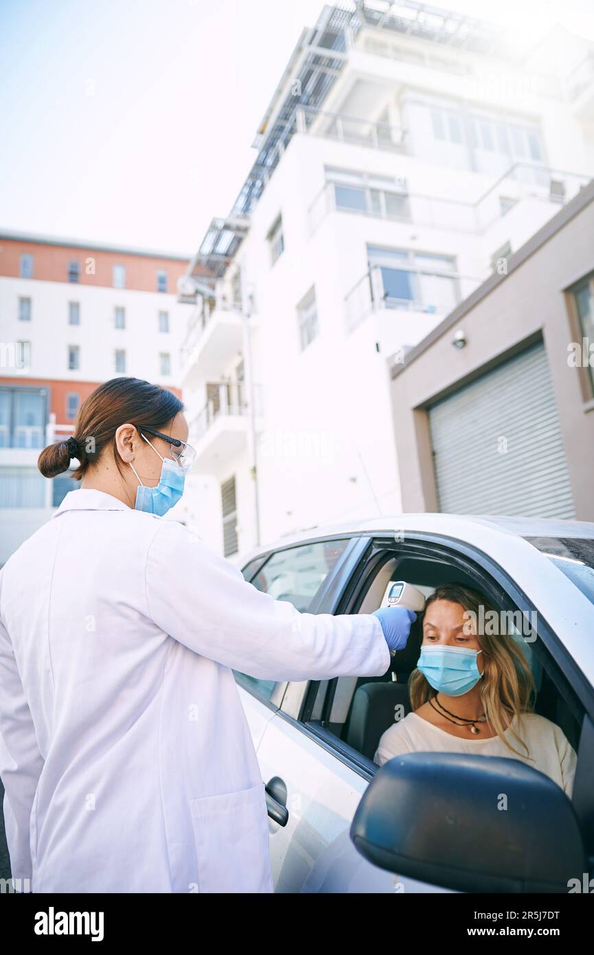 Getting screened gets you there safely. a masked young woman getting ...
