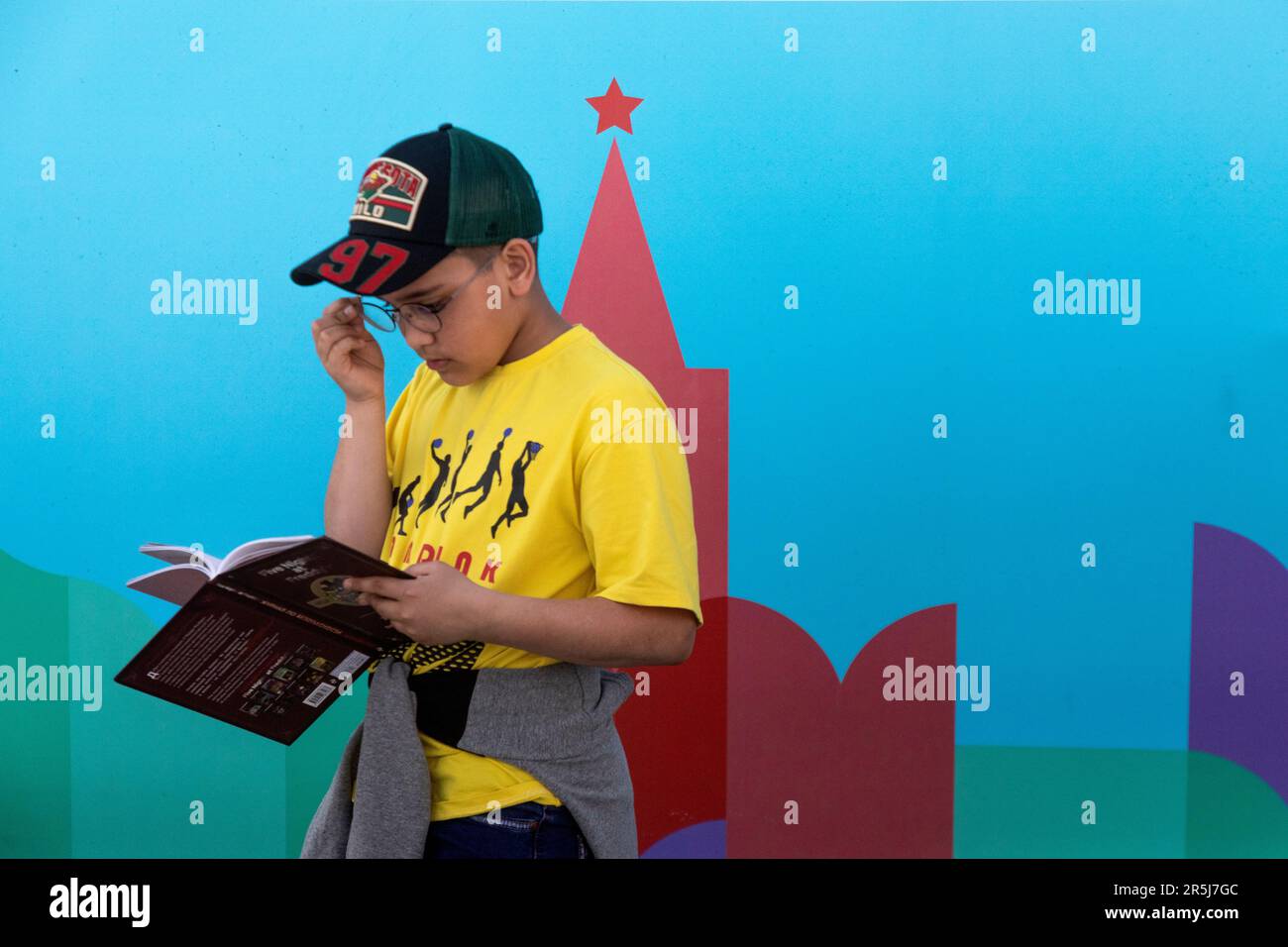 Moscow, Russia. 2nd of June, 2023. A child reads a book at the 9th ...