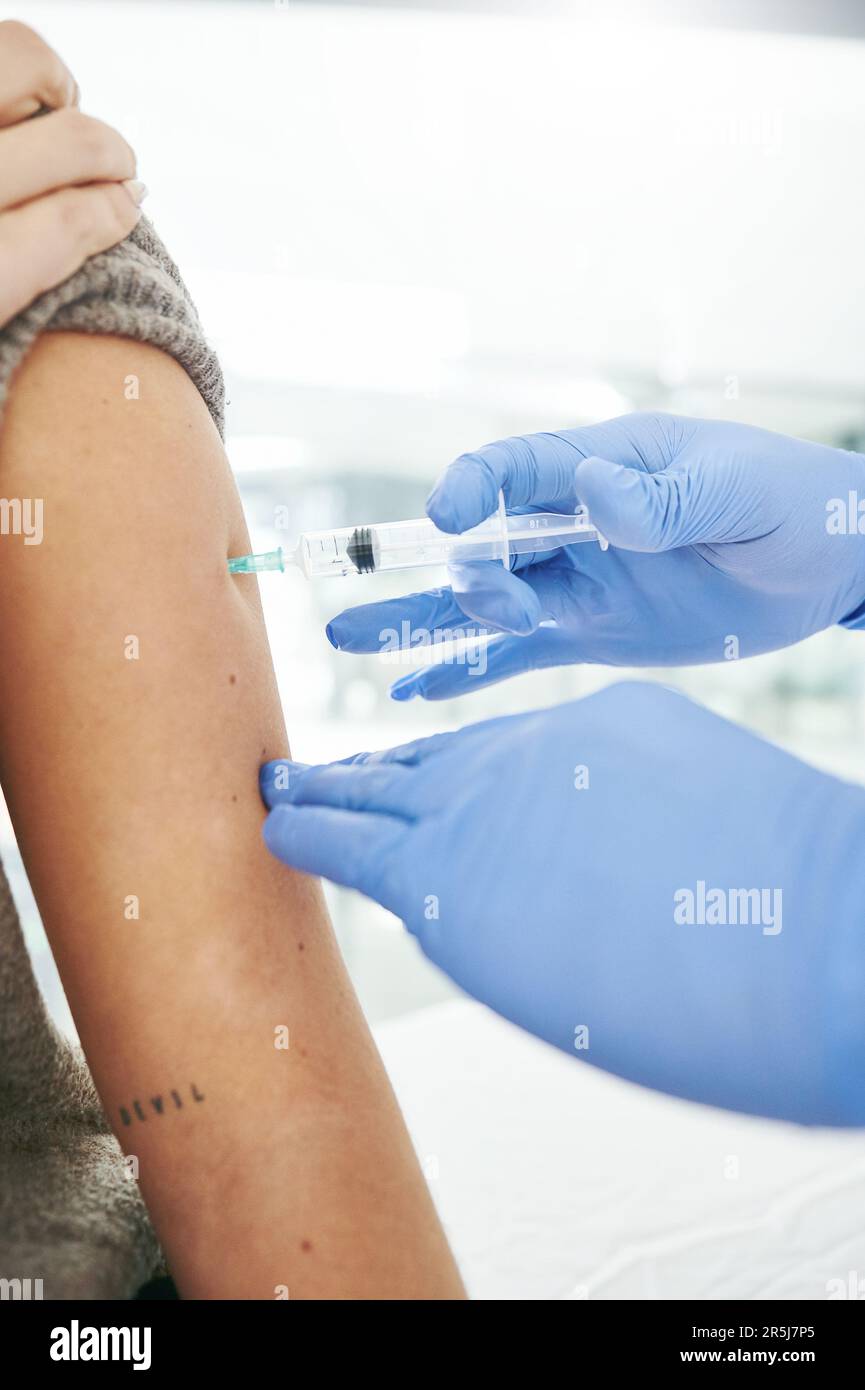 A quick shot to protect you. an unrecognizable doctor giving a patient ...