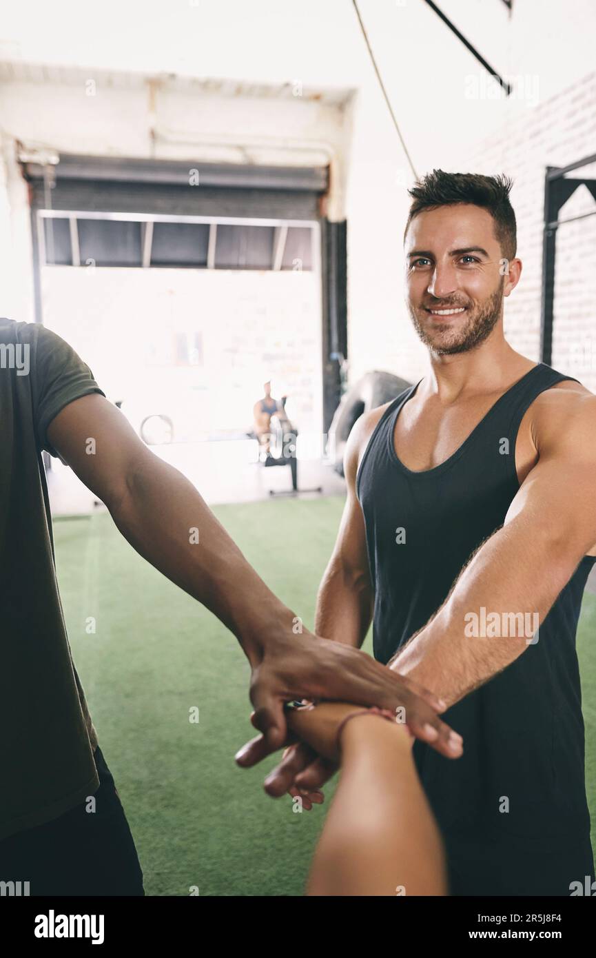 Group exercise encourages you to push yourself. three sporty young ...