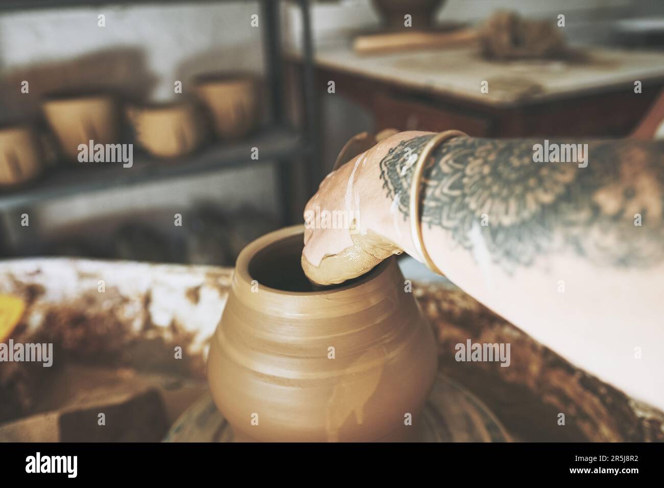 Home of the best pots in the world. an unrecognisable woman working ...
