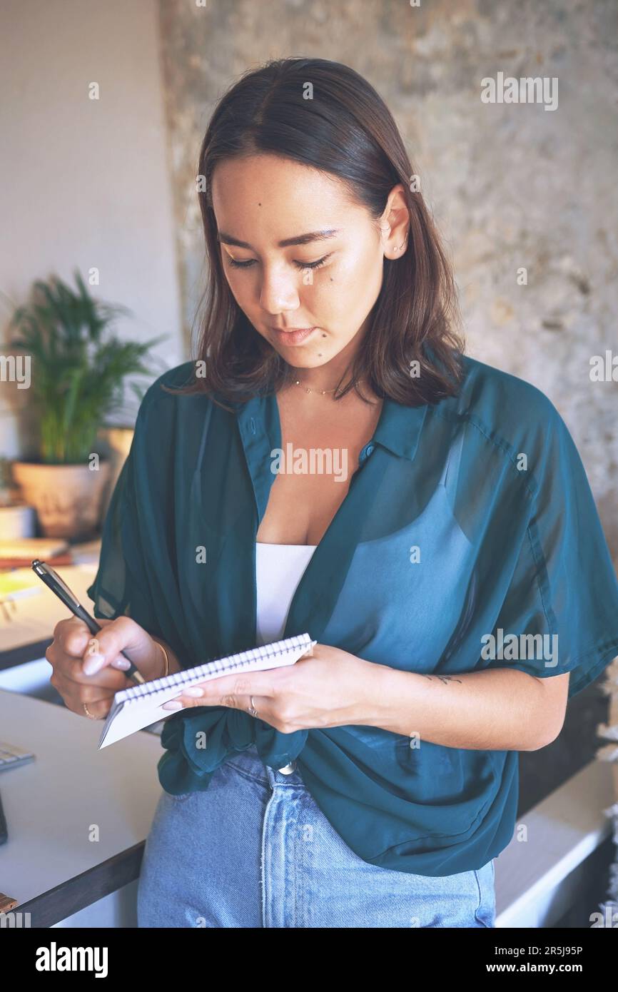 Contemplative asian woman pen home hi-res stock photography and images ...