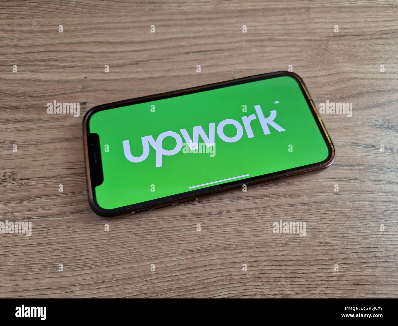 Konskie, Poland - May 28, 2023: Upwork microlabor platform logo displayed on mobile phone screen ...