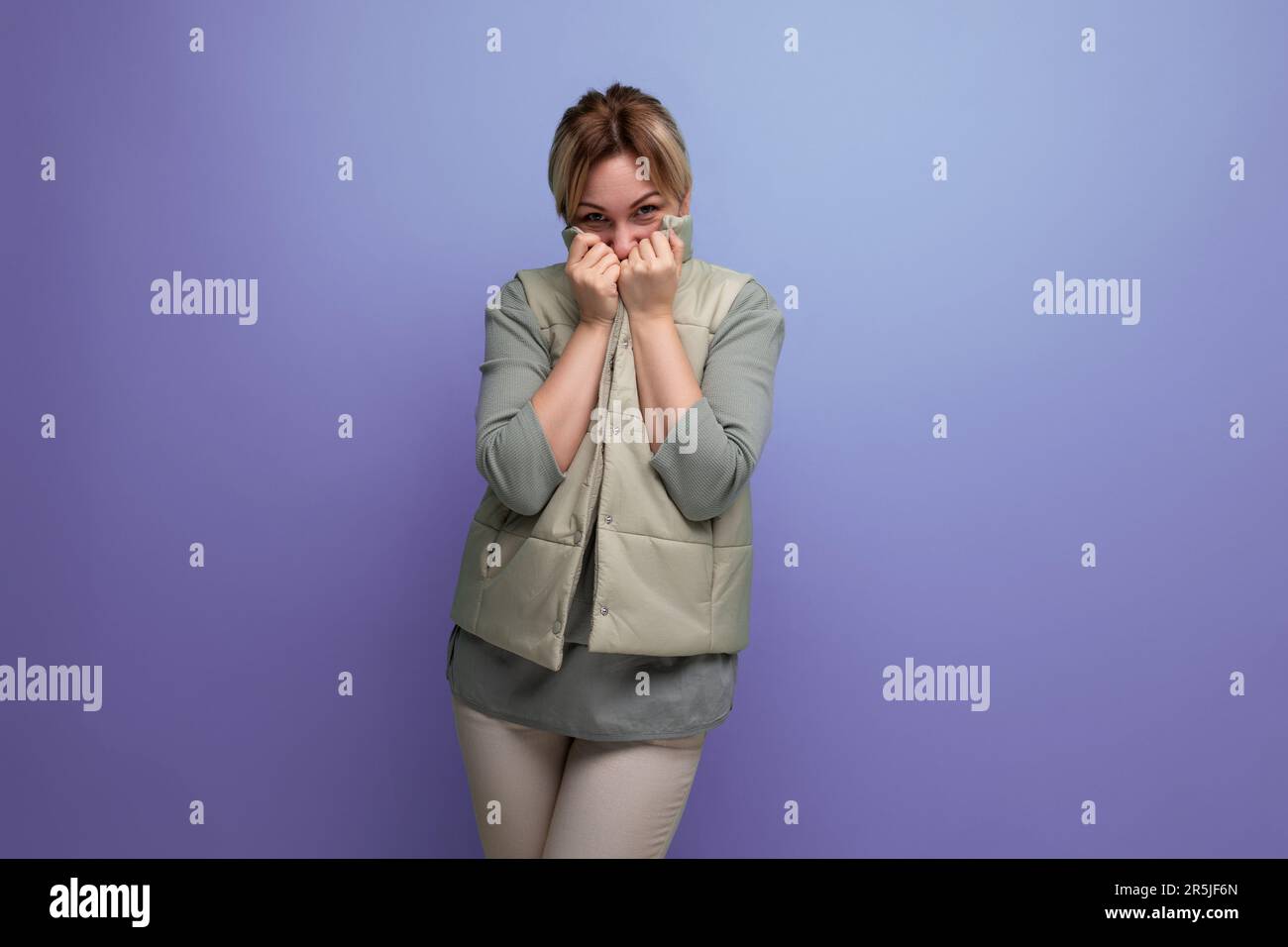 blond young woman in doubt feelings on studio background Stock Photo ...