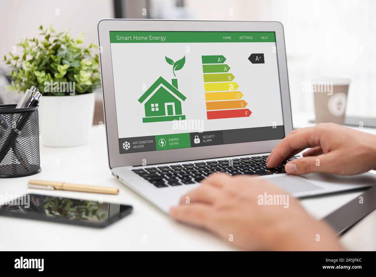 Energy efficiency app on screen. Ecology, eco house concept Stock Photo ...