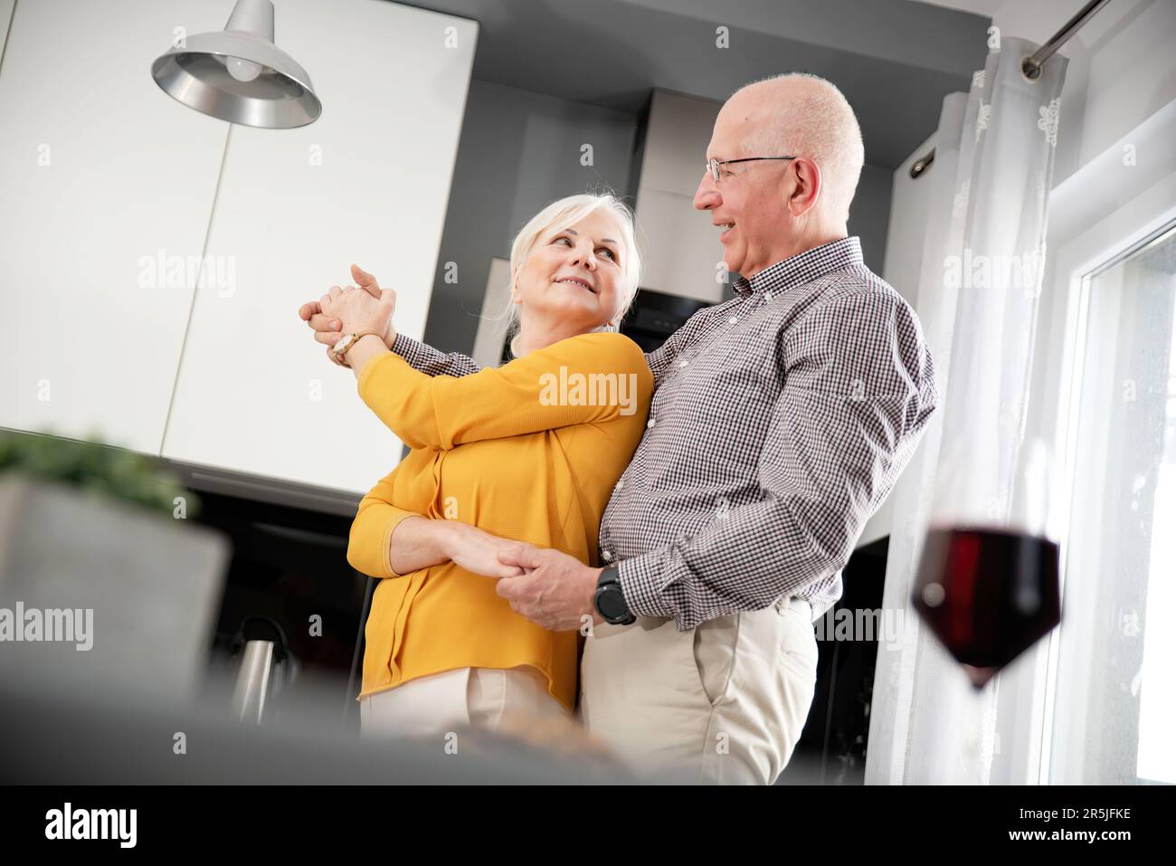 Seniors dancing at home, happy retirement, happy senior couple at home ...