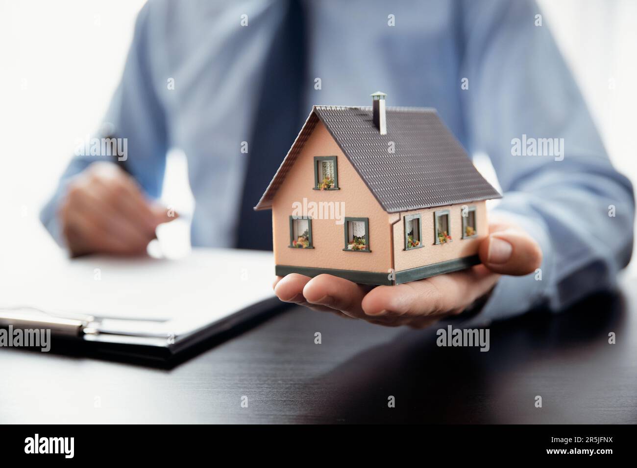 Real estate agent offer house represented by model. Buy and sell house ...