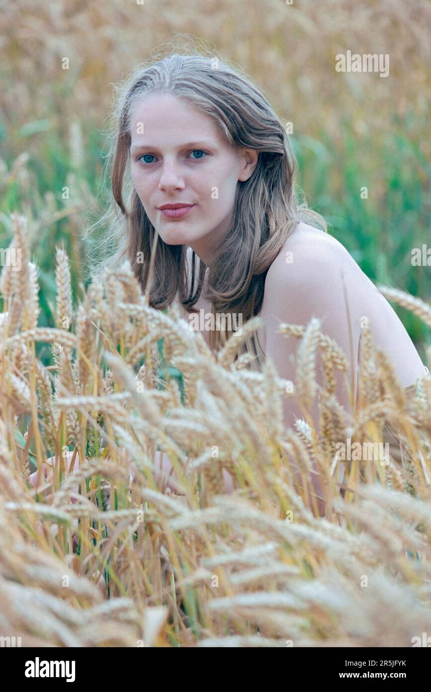 young slim pretty blonde haired woman in her early 20s posing for ...