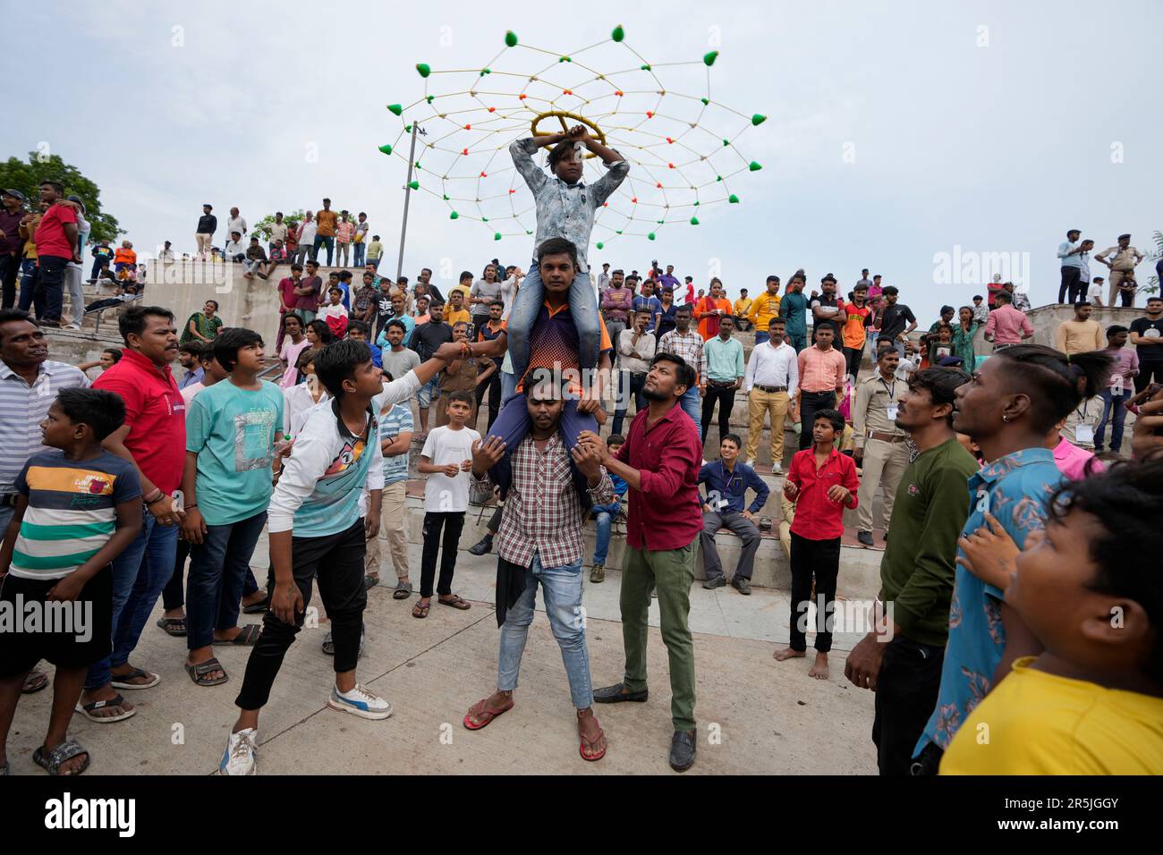 Boys perform stunts during Jal Yatra procession ahead of the annual ...