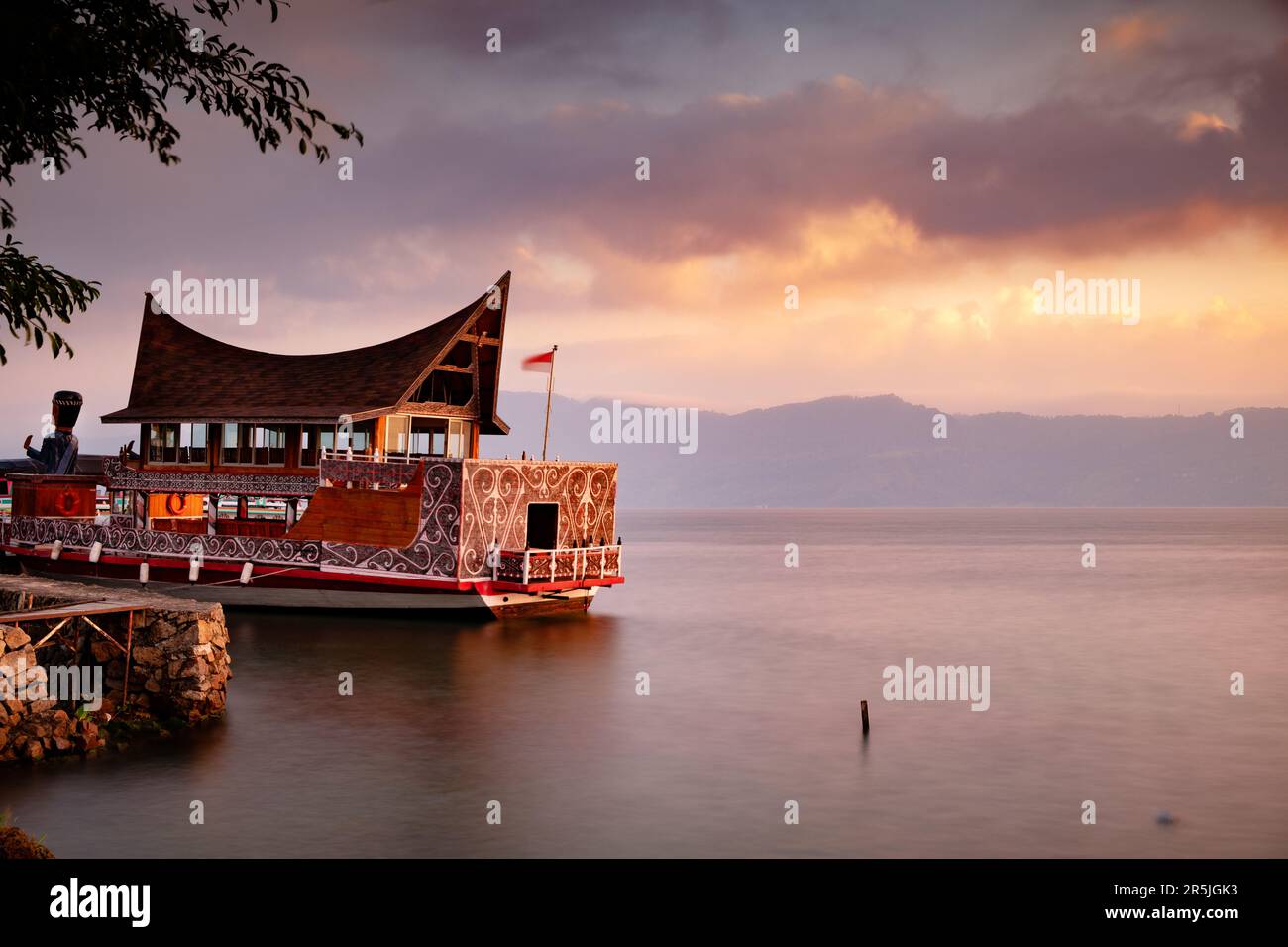 bataknese (one of indonesian tribe) traditional boat. harbour on the ...