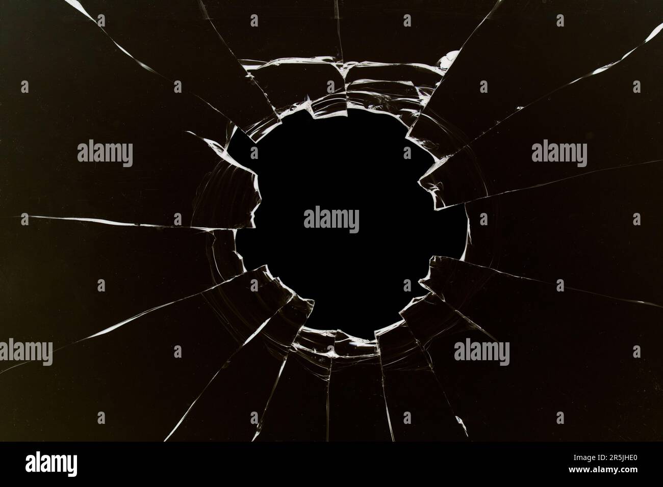 Hole in the glass, broken window with cracks texture. Effect of broken ...