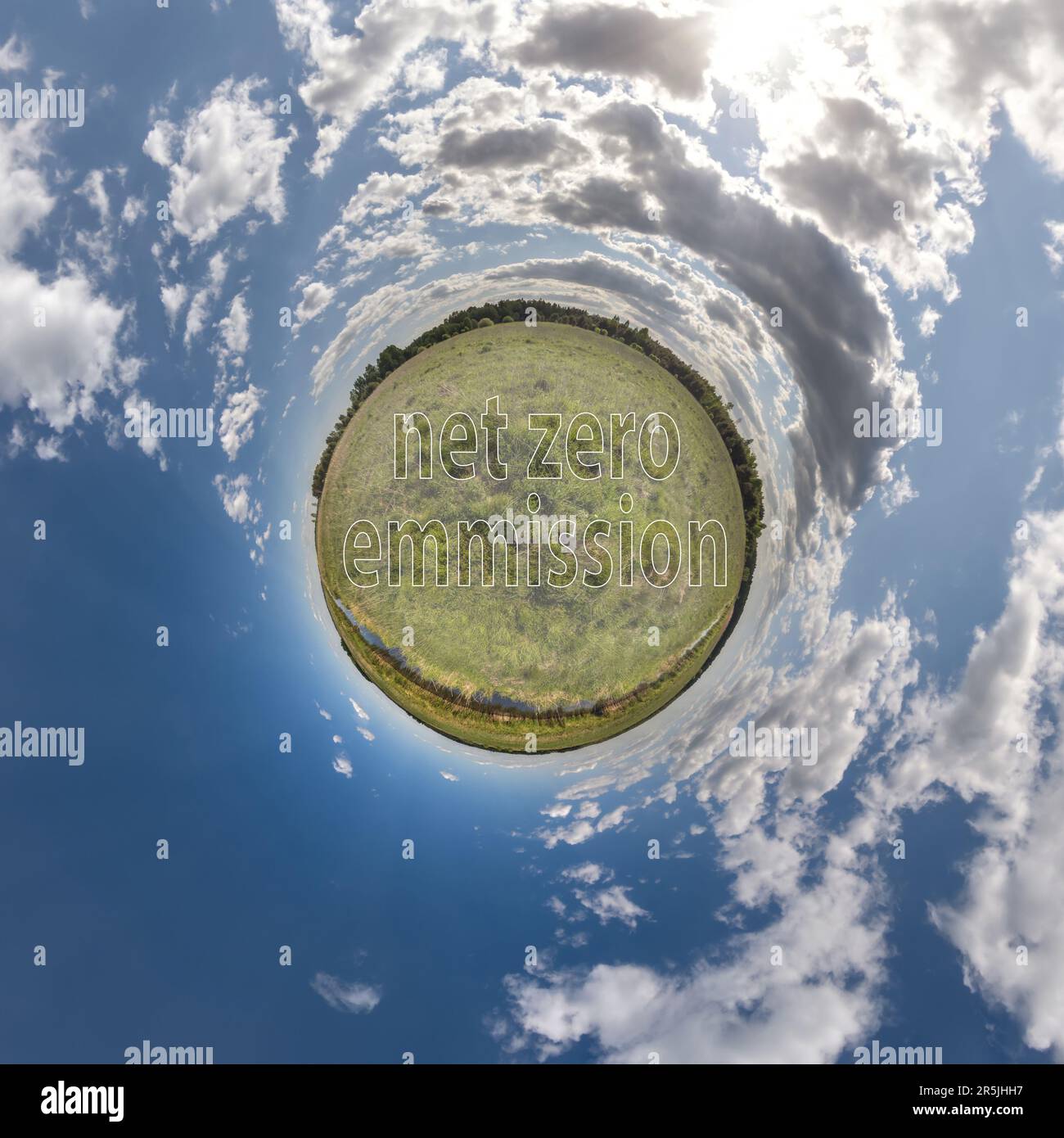 net zero emissions text concept image against green tiny planet in blue ...