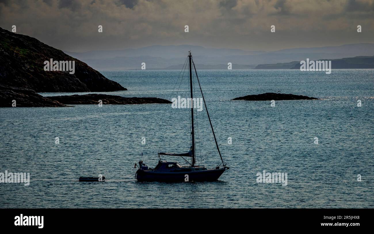 A lone yacht off the coast of Coll, Scotland Stock Photo - Alamy