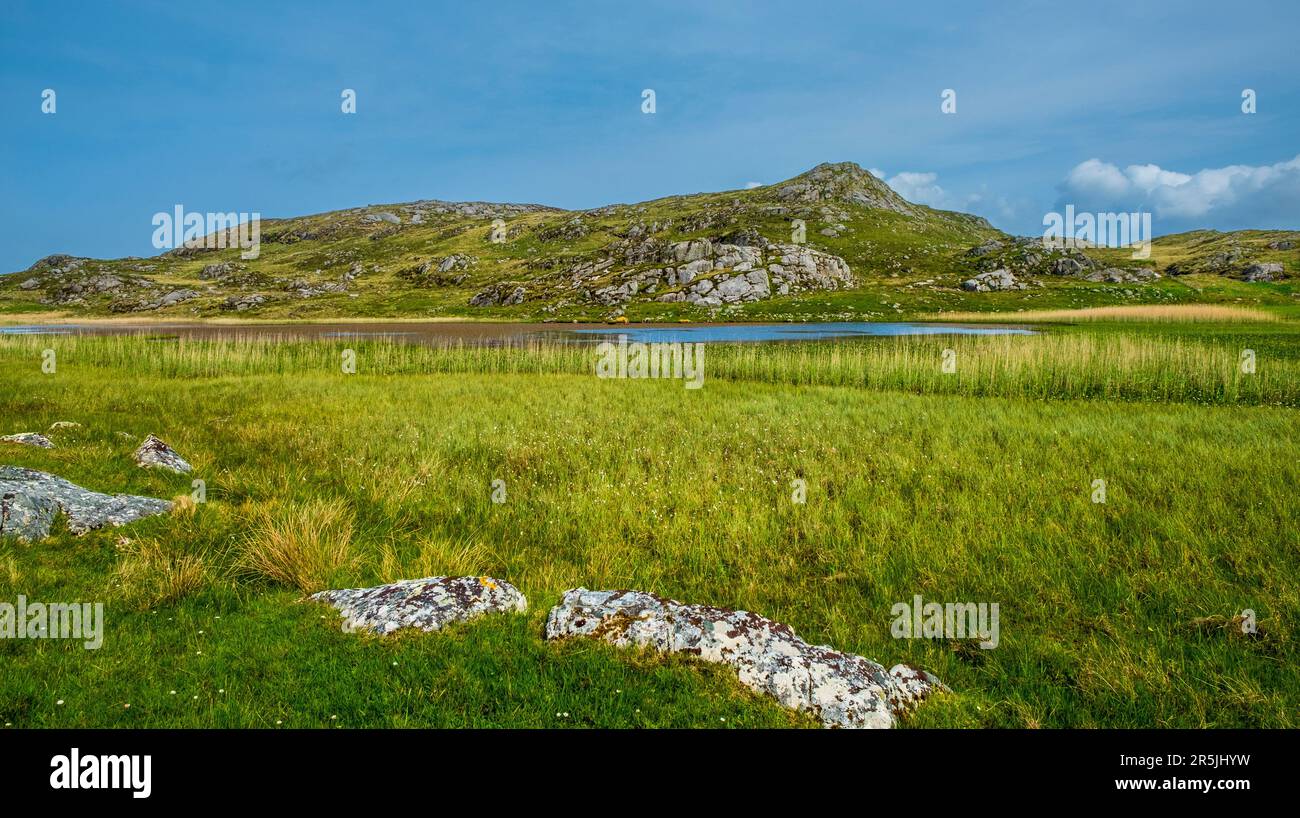 Ben Hogh (106 metres) is the highest hill on Coll with Loch Ballyhaugh ...