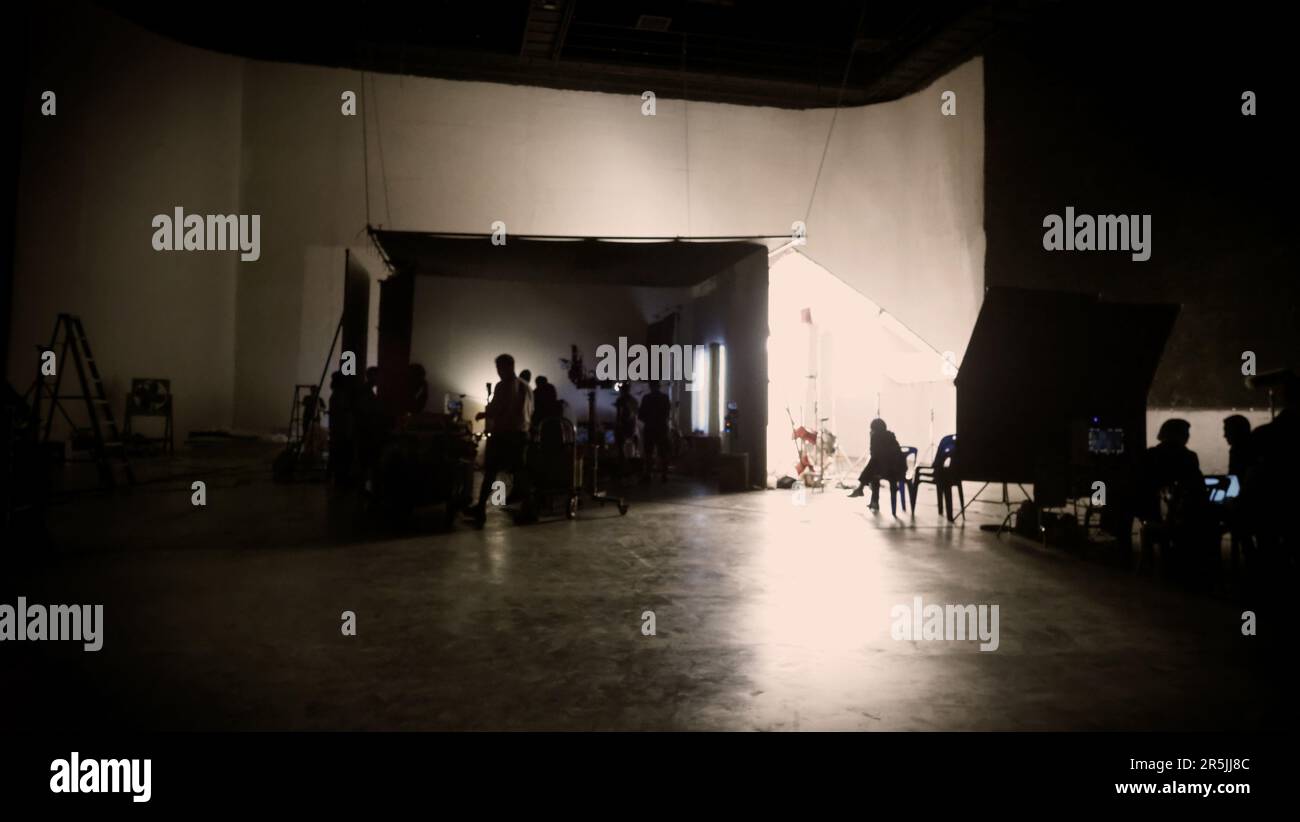 Blurry images of film crew working and filming in video production ...