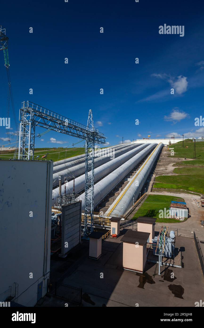 Hydro power plant pipes and transformer station with electric tower ...