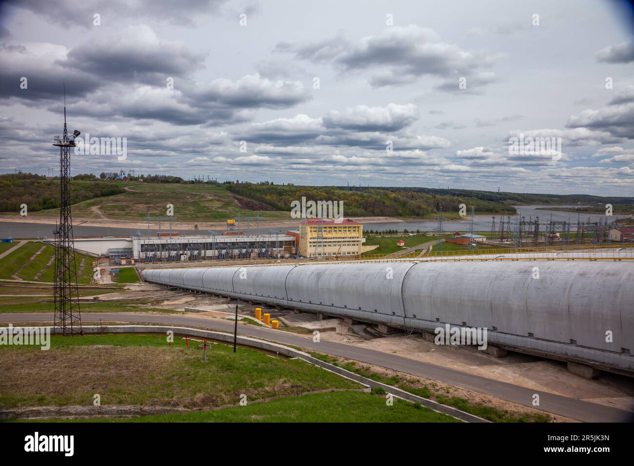 hydro power plant pipes on grey sky background Stock Photo - Alamy