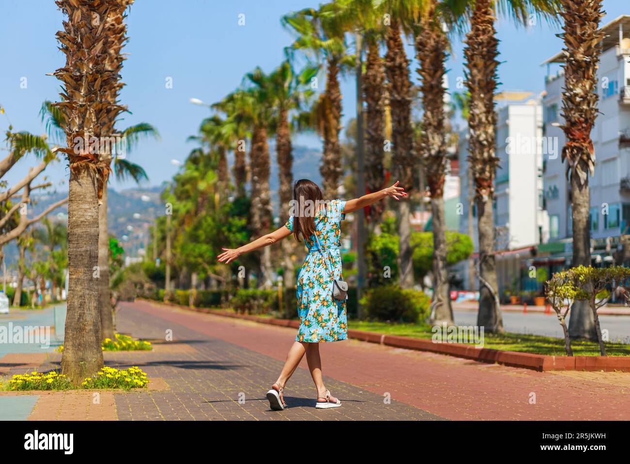 Tourist woman on promenade Cleopatra beach in Alanya, Antalya, Turkey ...