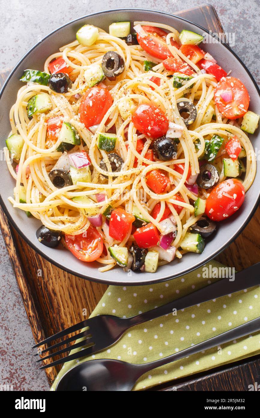 Cold Italian spaghetti salad features fresh veggies and lots of yummy ...