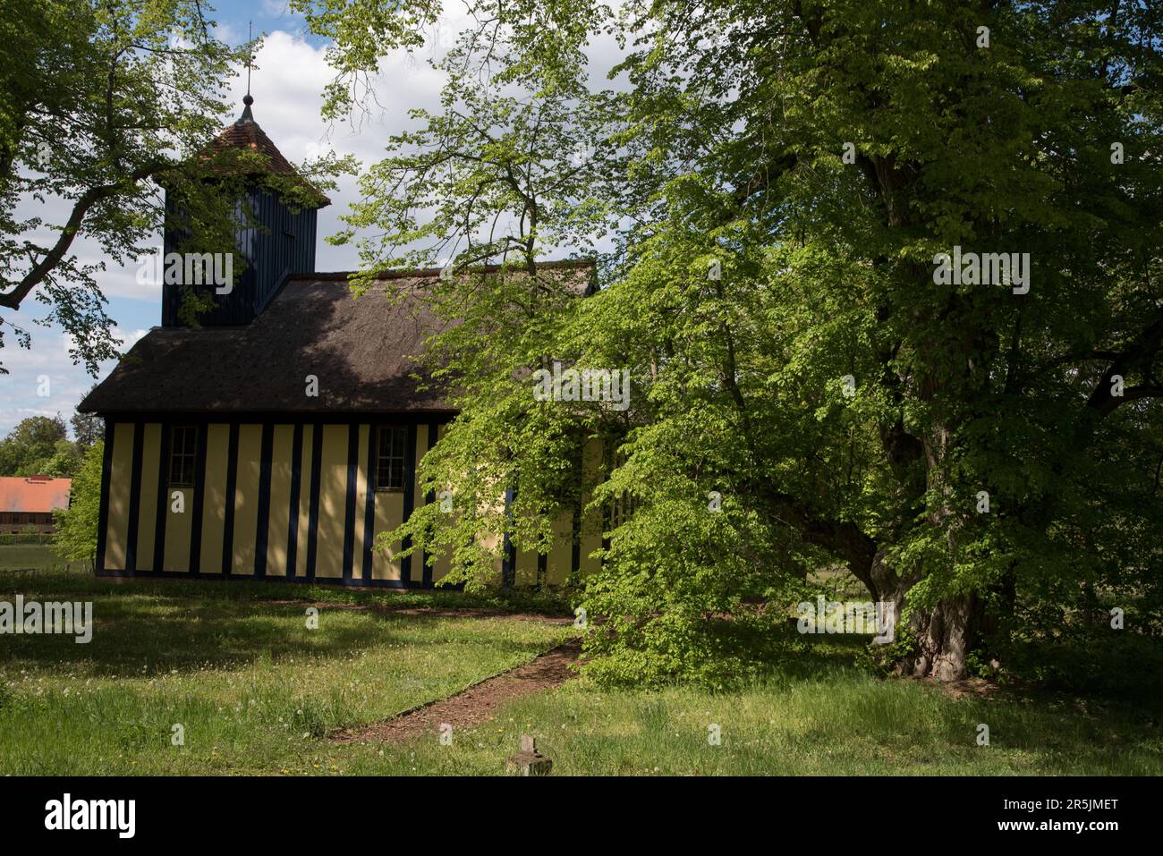 small church in the green is a tiny timber framed and restored church ...