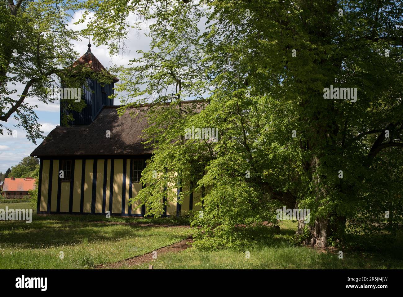 small church in the green is a tiny timber framed and restored church ...