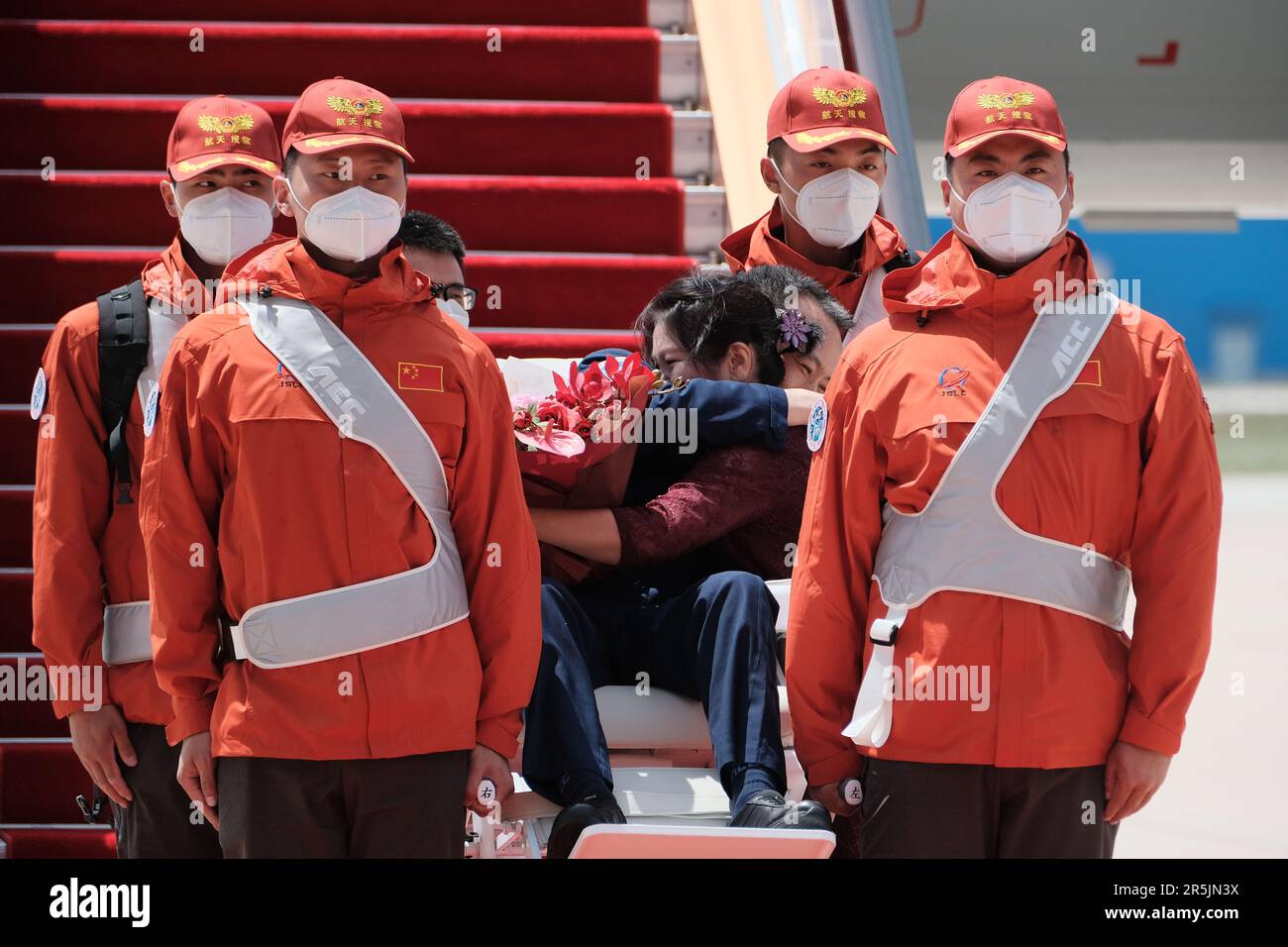 Beijing, China. 4th June, 2023. Astronaut Fei Junlong hugs his wife ...