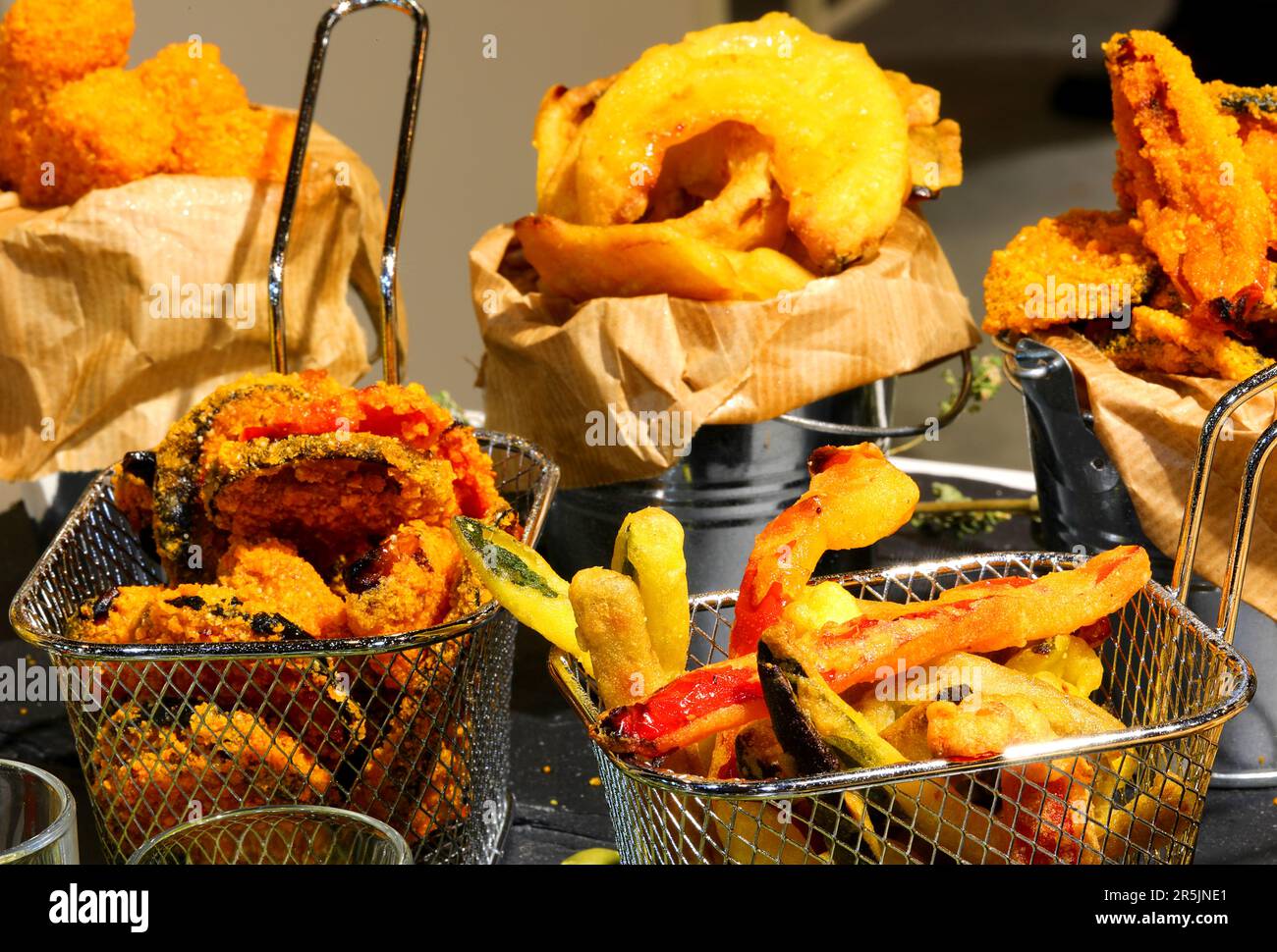 trays of mixed fried vegetables with battered and french fries for sale ...