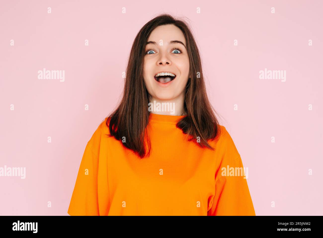 Energetic Expression: Impressed and Cheerful Woman with Open Mouth ...