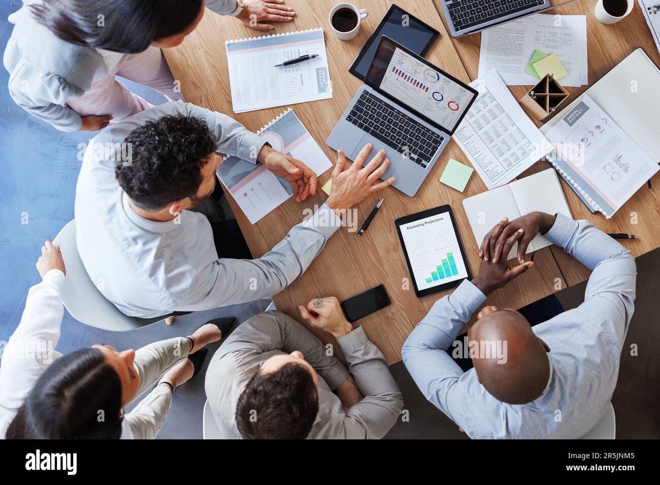 Laptop, planning and teamwork with business people in meeting from ...