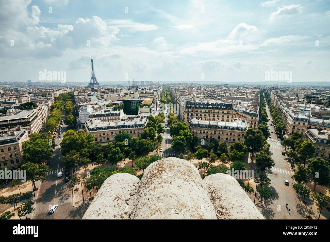 Drone shot of Paris cityscape with the Eiffel Tower in the distance ...