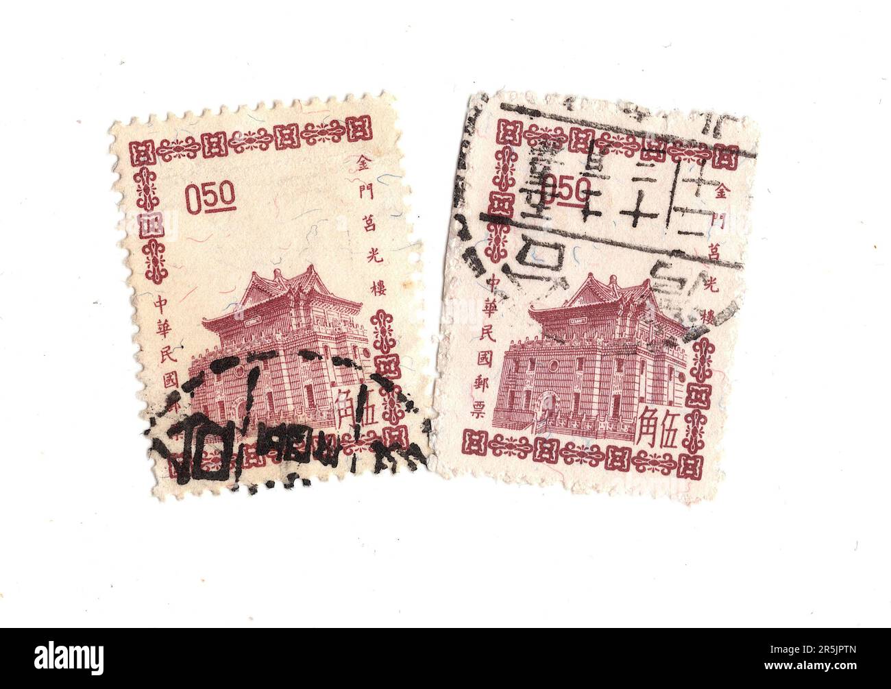 Red vintage postage stamps from China featuring historic buildings isolated on a white ...