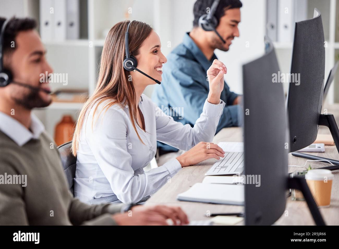 Call center, woman and working in team office with headset, computer ...