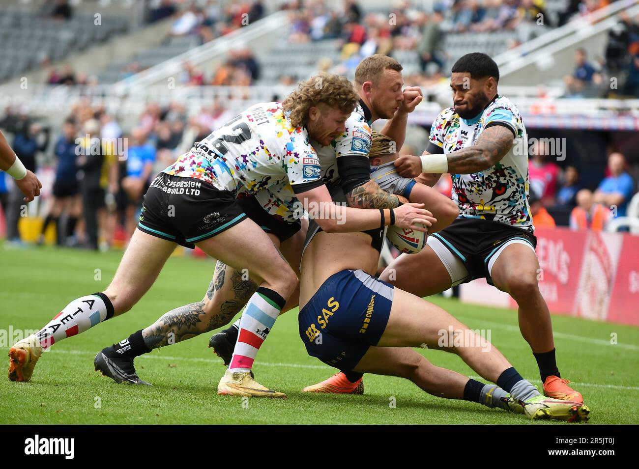 Tom Lineham #5 of Wakefield Trinity tackled during the Magic Weekend ...
