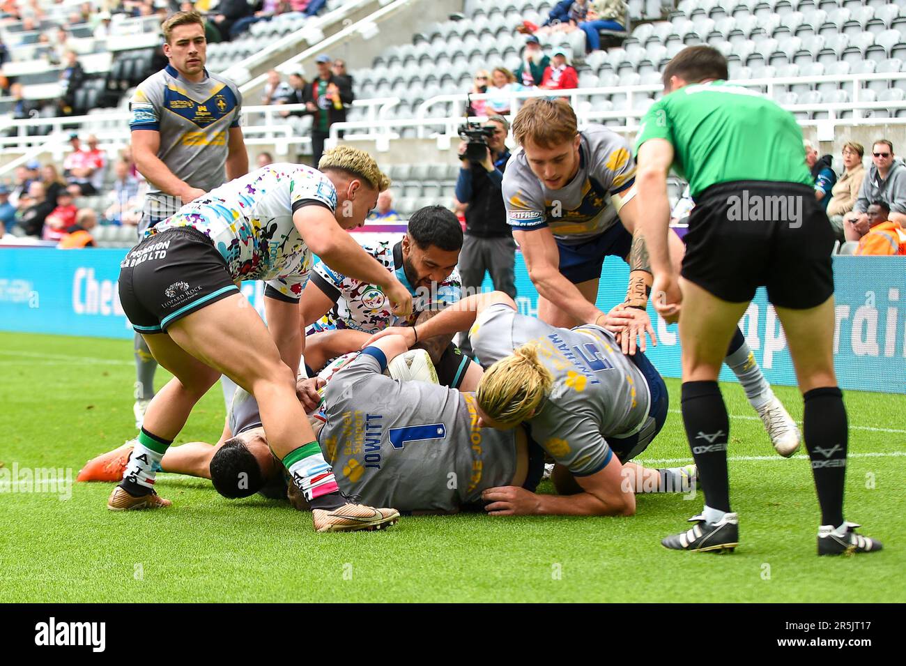 Josh Charnley #5 of Leigh Leopards held up over the line during the Magic Weekend match ...
