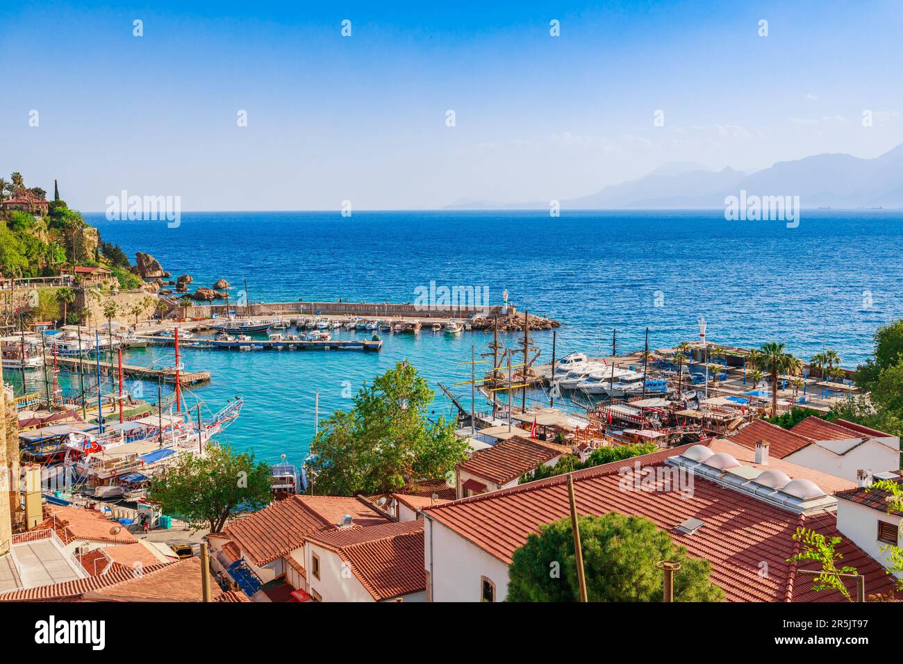 Old town Kaleici in Antalya, Turkey. Bay with ships and boats in summer ...