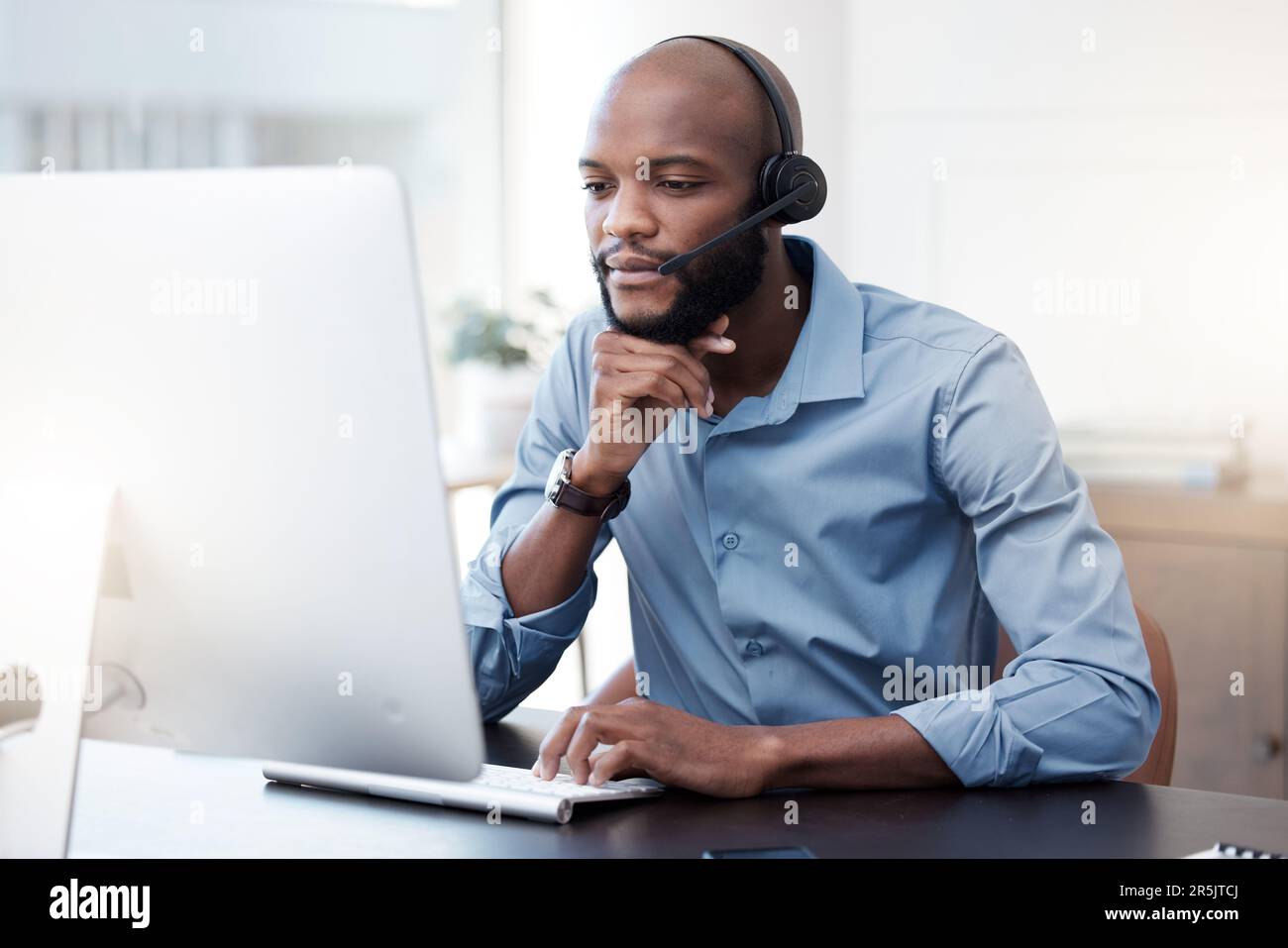 Black man, computer and call center, thinking with contact us and ...