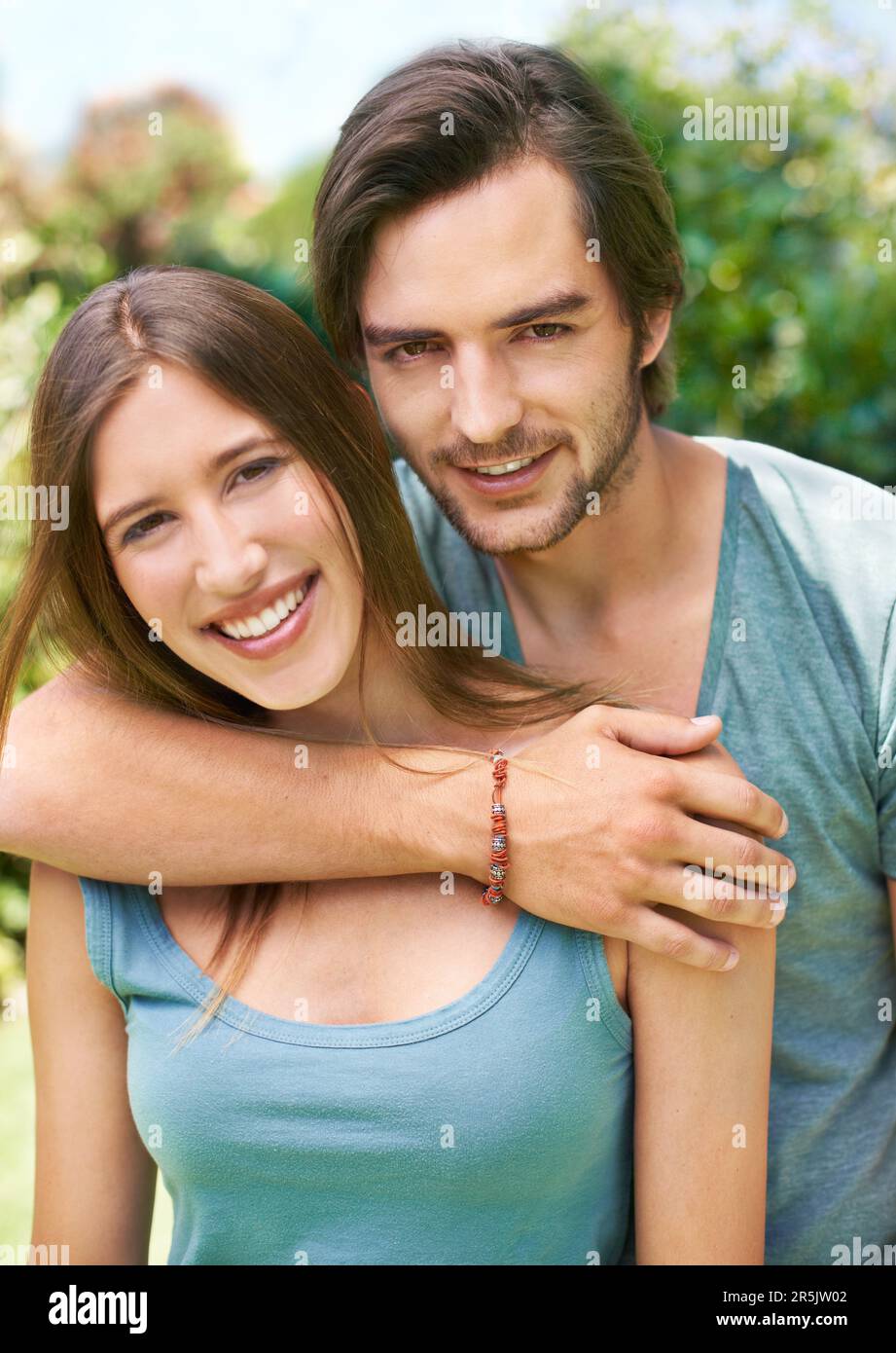 We couldnt be happier. An adoring boyfriend hugging his girlfrined as ...