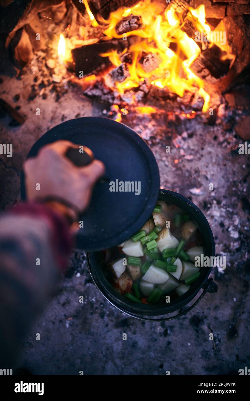Food as good as nature intended. a man cooking traditional South ...