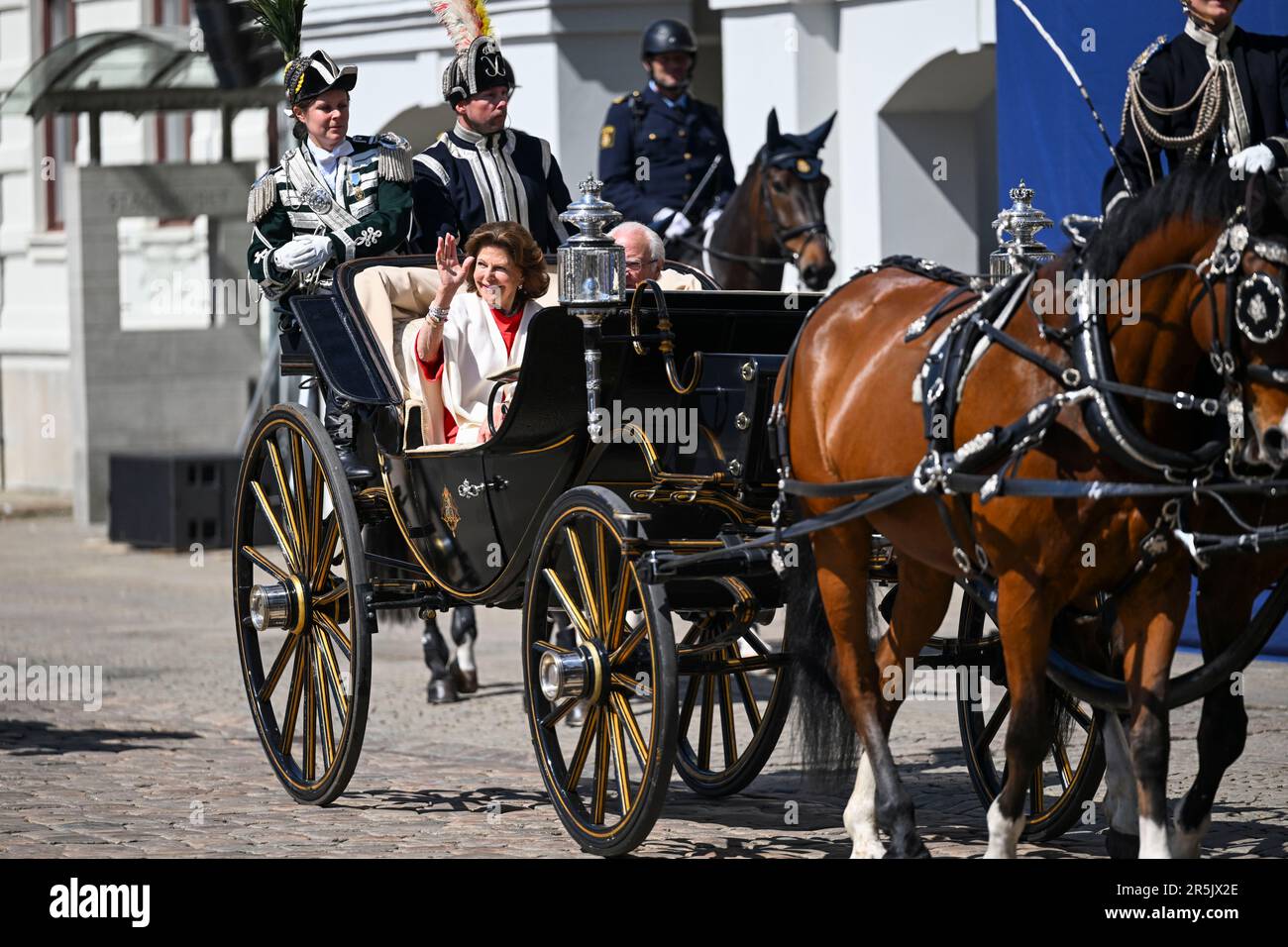 King Carl Gustaf and Queen Silvia arrive at Gustaf Adolfs Torg during ...