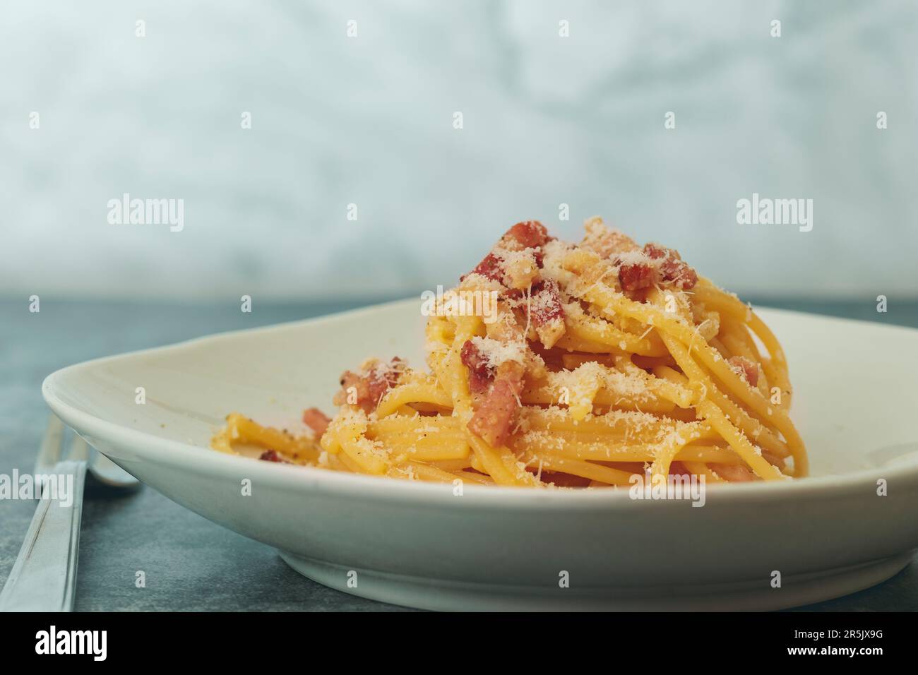 A plate of spaghetti carbonara. A traditional recipe made with pasta ...