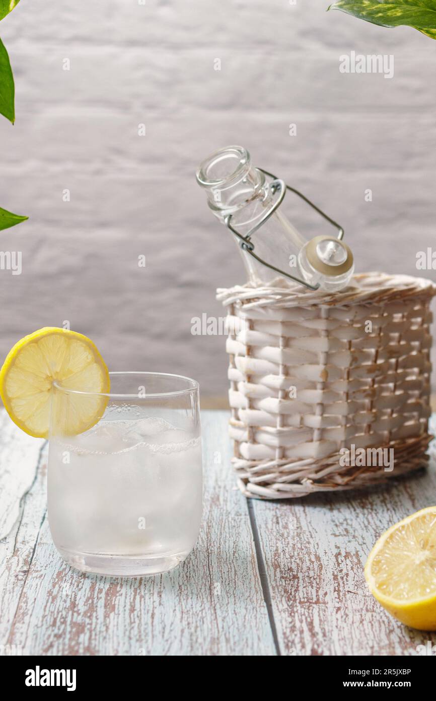 A glass of water with ginger and lemon. A very refreshing drink. In the ...