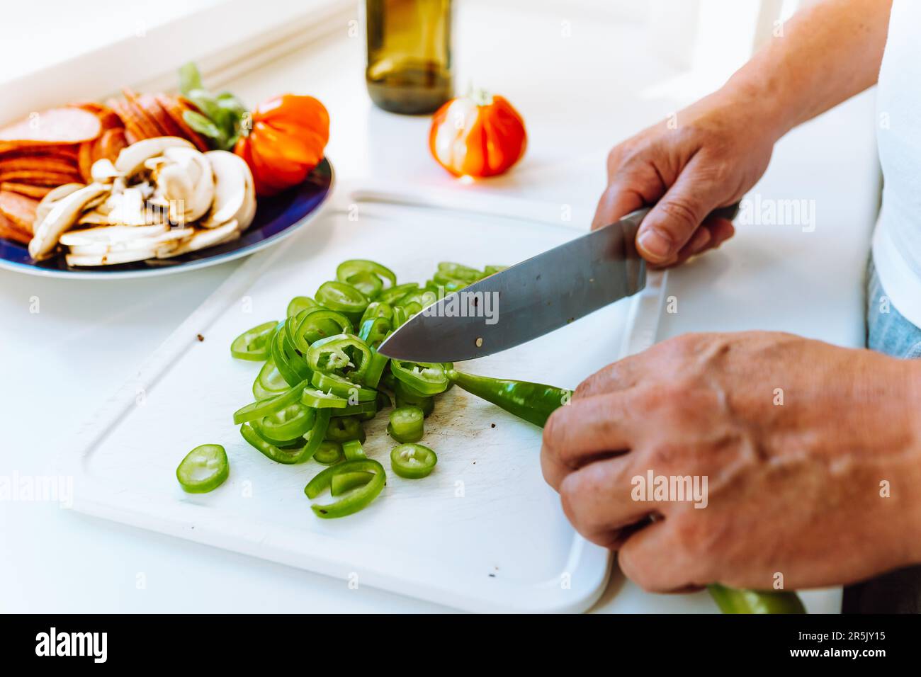 Hands man close-up top view cut pepper into slices Stock Photo - Alamy