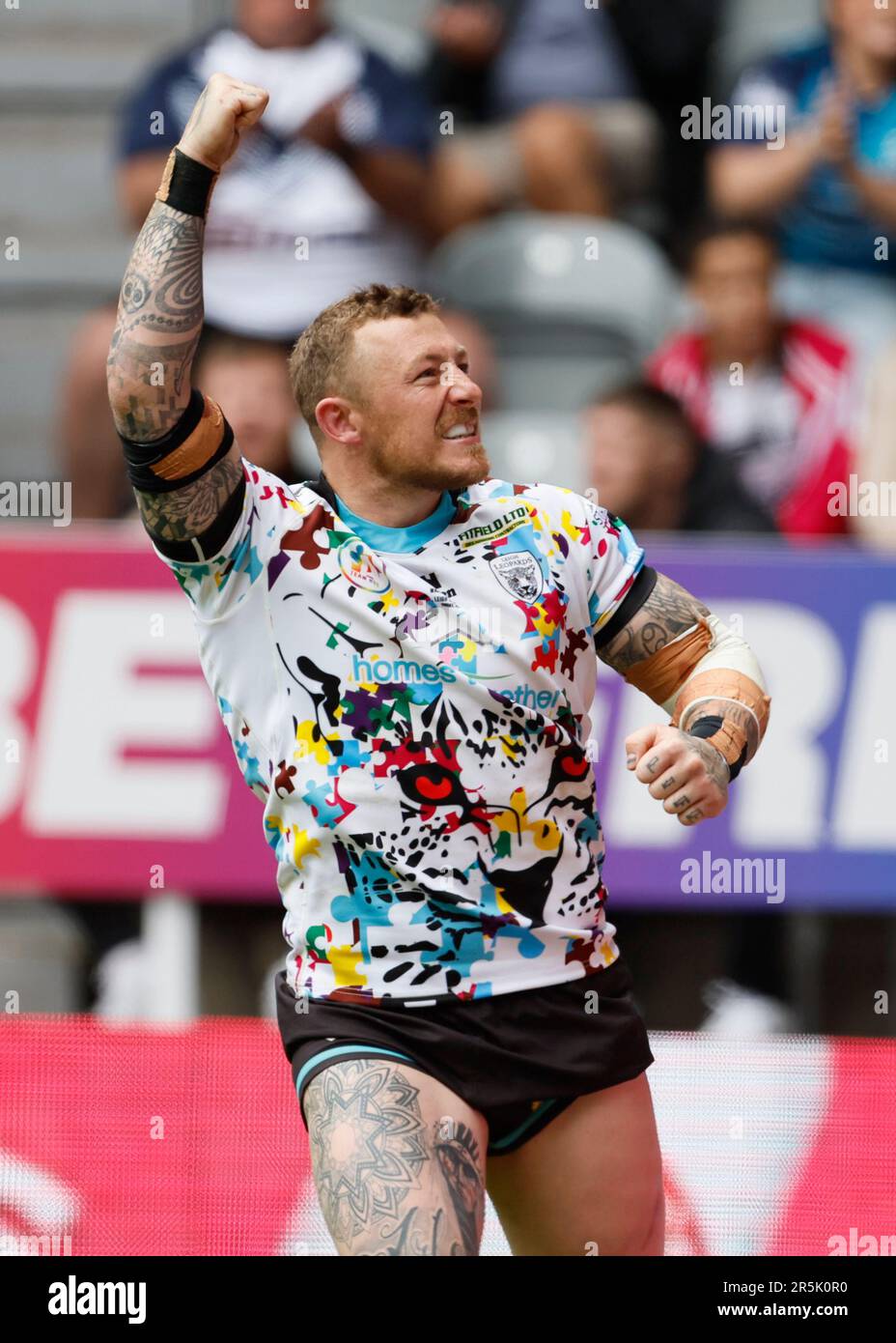 Leigh Leopards’ Josh Charnley celebrates after scoring a try during the ...