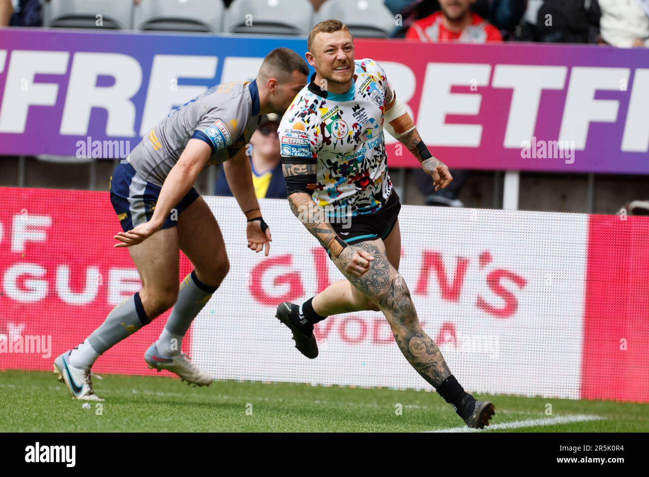 Leigh Leopards’ Josh Charnley celebrates after scoring a try during the ...