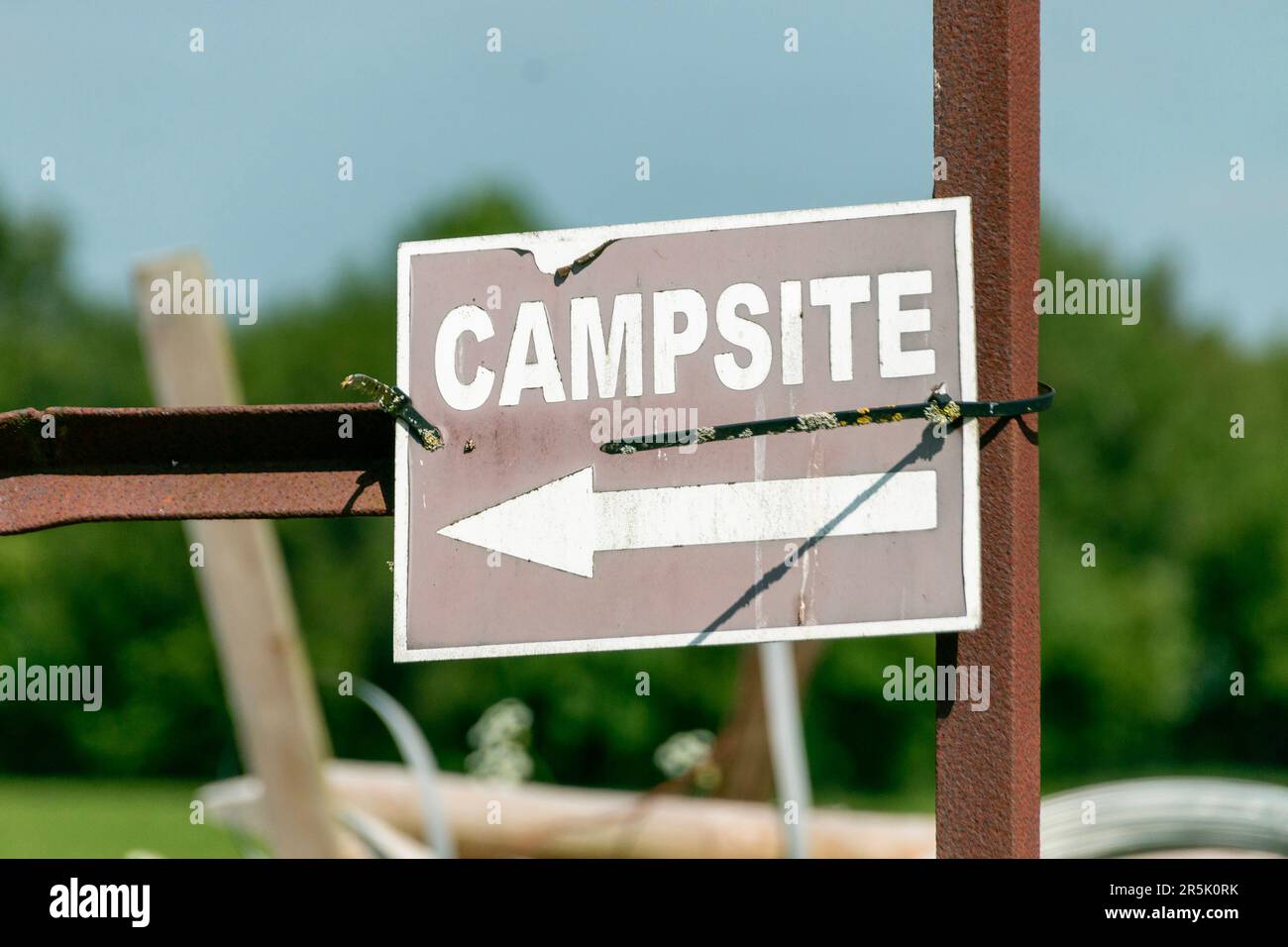 A close up view of a camping site direction sign Stock Photo - Alamy
