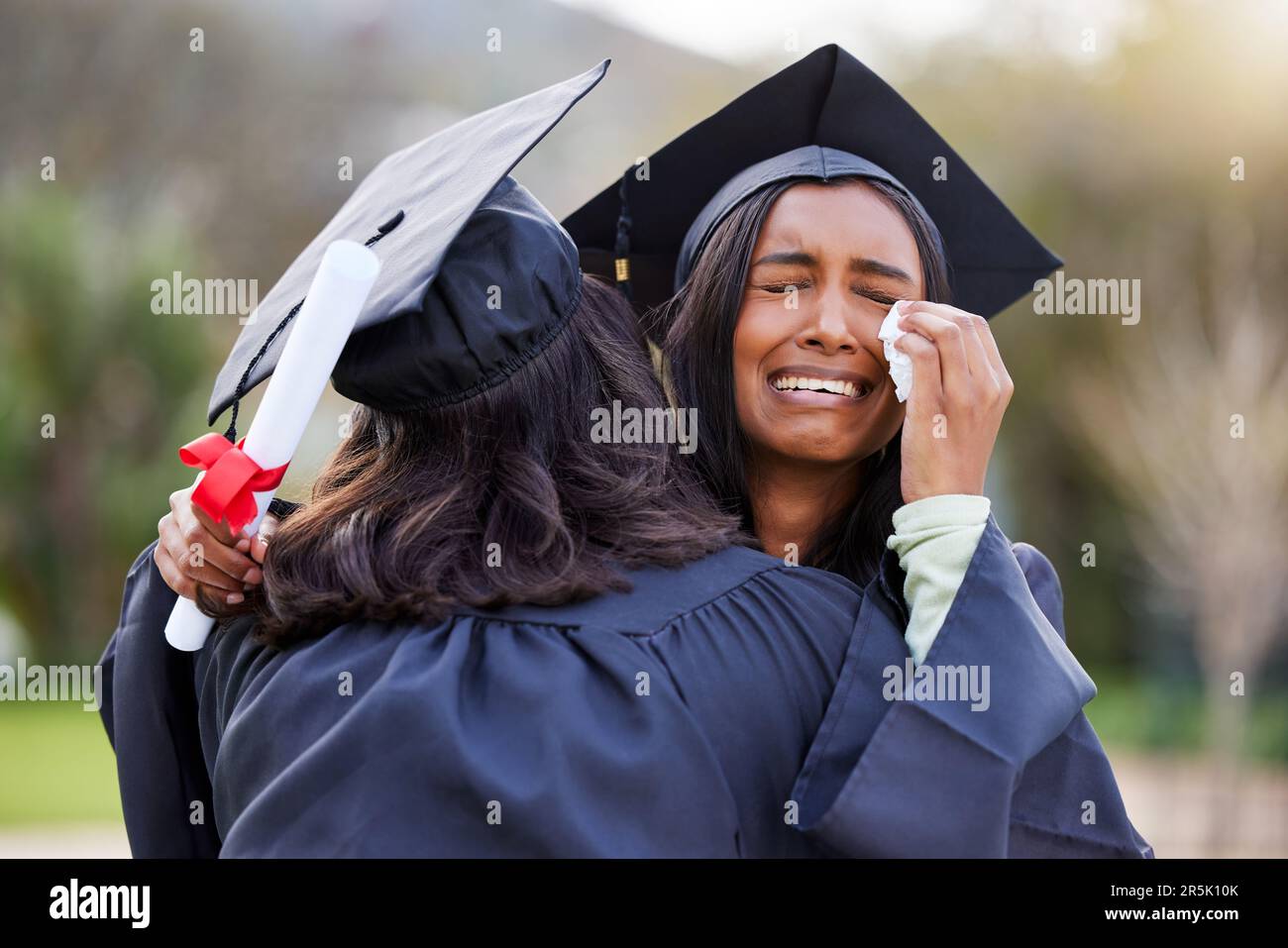 Education, graduation and crying with friends hugging in support or ...