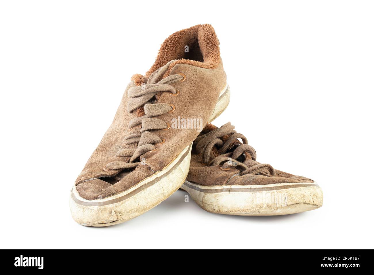 Old dirty brown sneakers, isolated on white background. The file ...