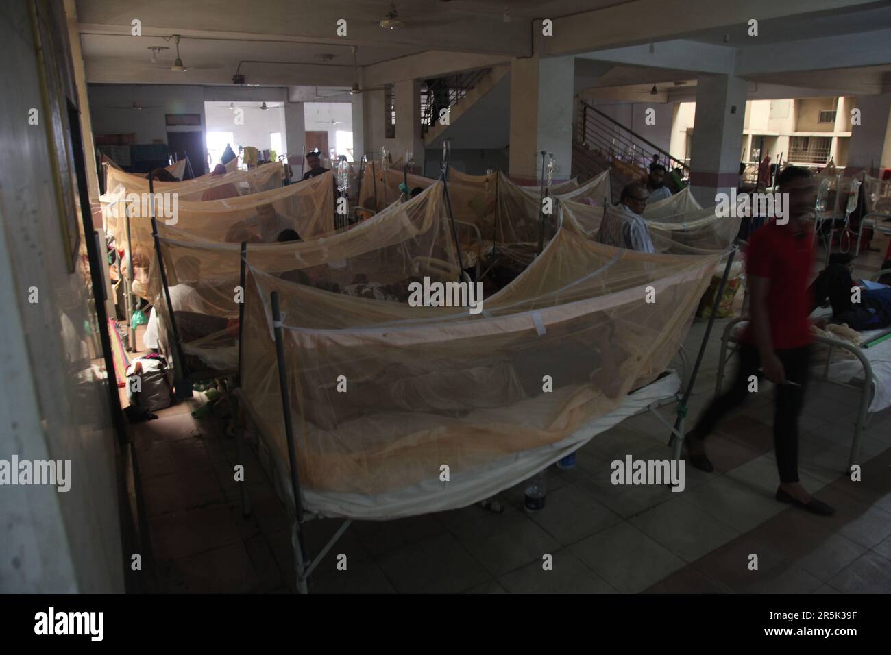 Dengue fever patients lying on the floor and on the bed outside the ...