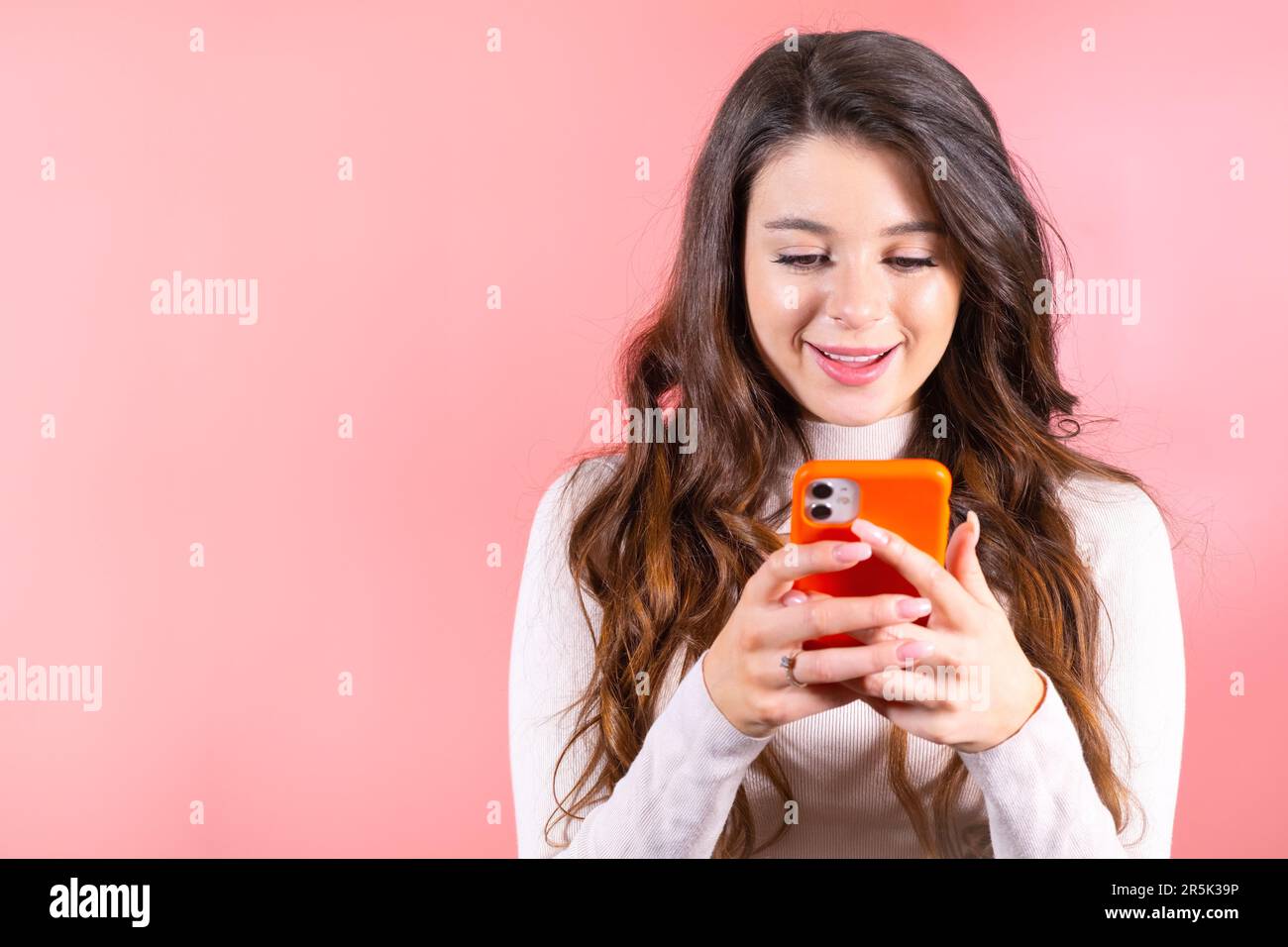 Woman types message in mobile hi-res stock photography and images - Alamy