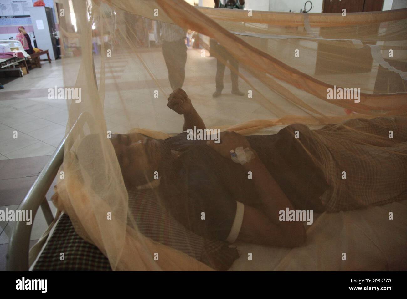 Dengue fever patients lying on the floor and on the bed outside the ...